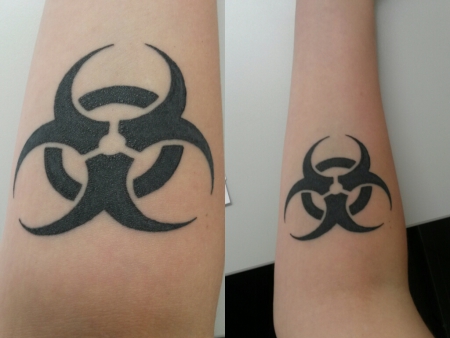 Woman Biohazard Tattoos